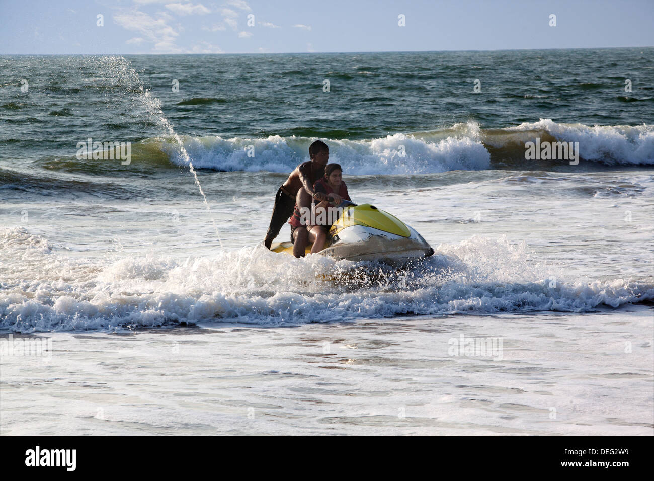 Tourists riding jet boat on the beach, Candolim, Bardez, North Goa, Goa ...