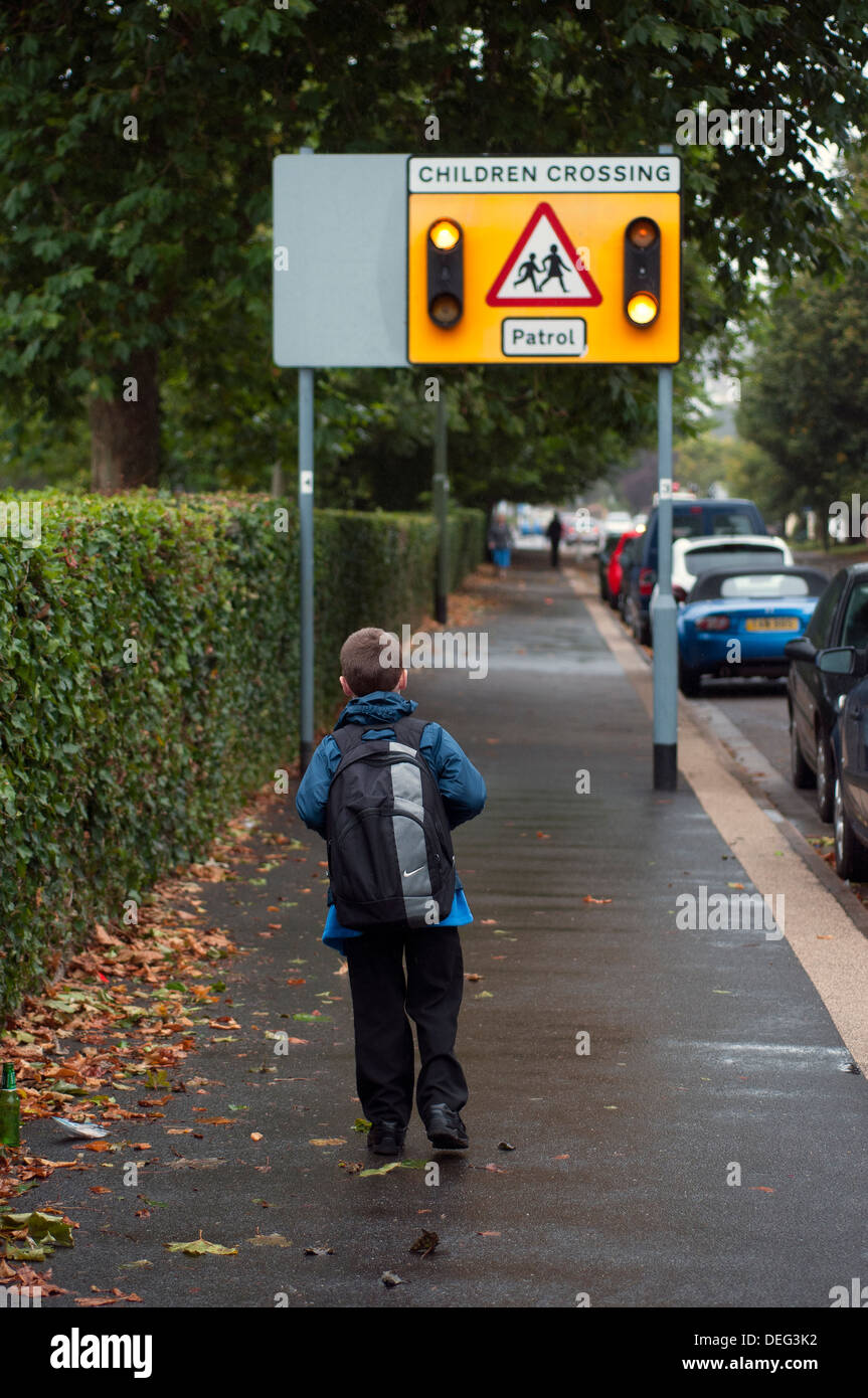 Lone child walking to schoollone child walking to school hi-res stock ...