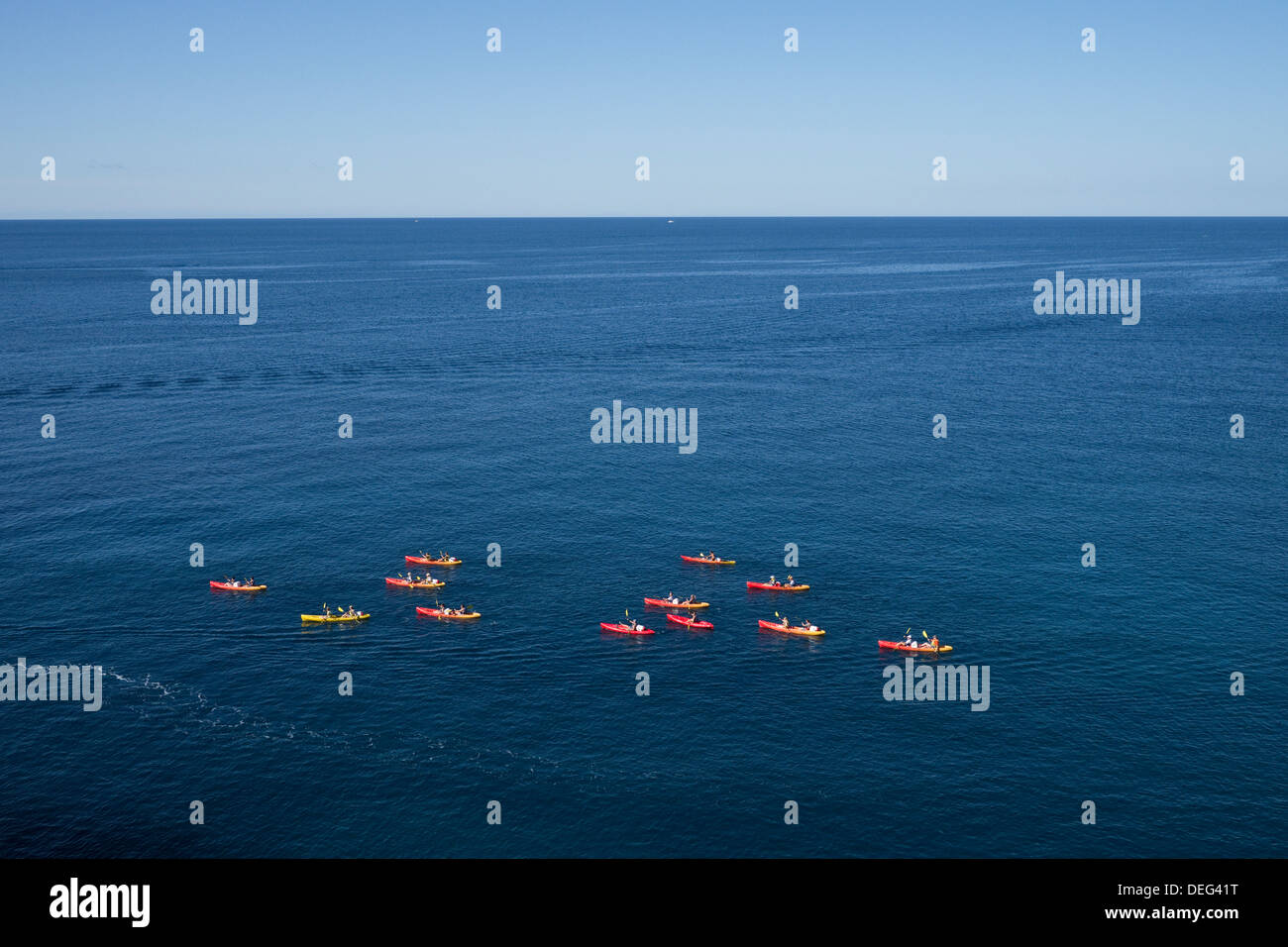 colorful canoes on the ocean Stock Photo - Alamy