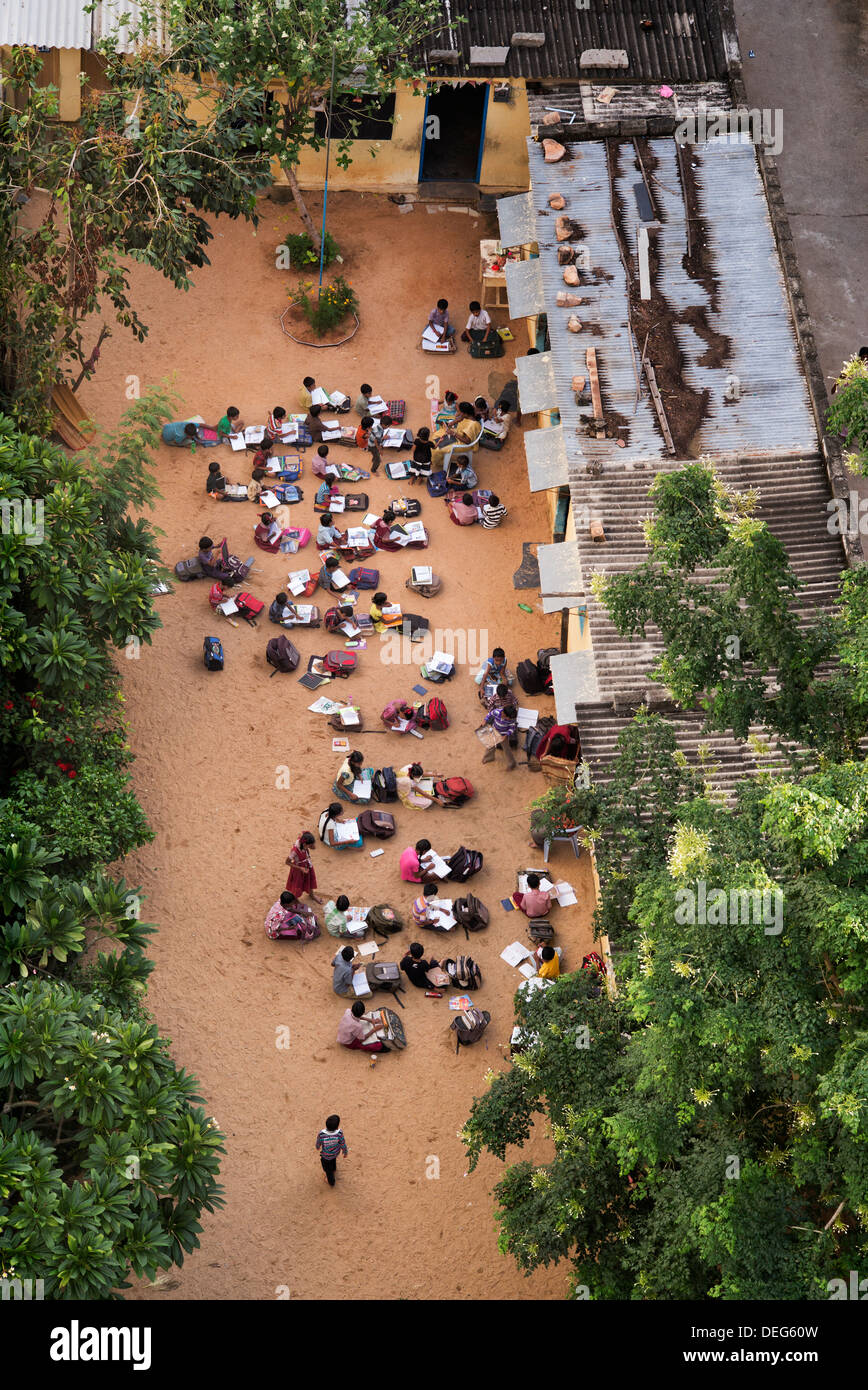 Indian English Medium school with children doing tuition sitting in the ...