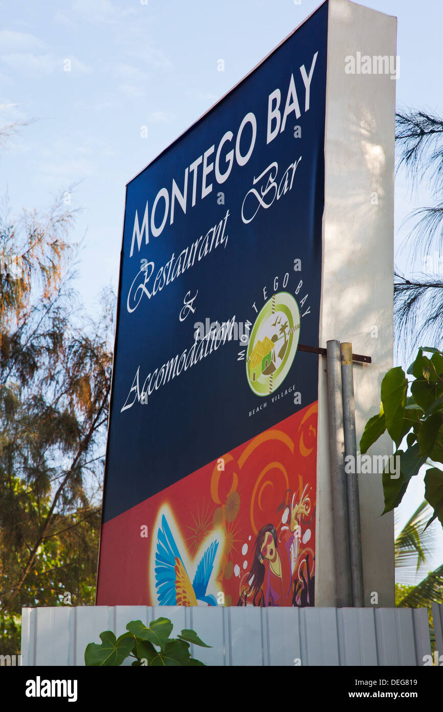 Sign board of a tourist resort, Montego Bay Beach Village, Morjim ...