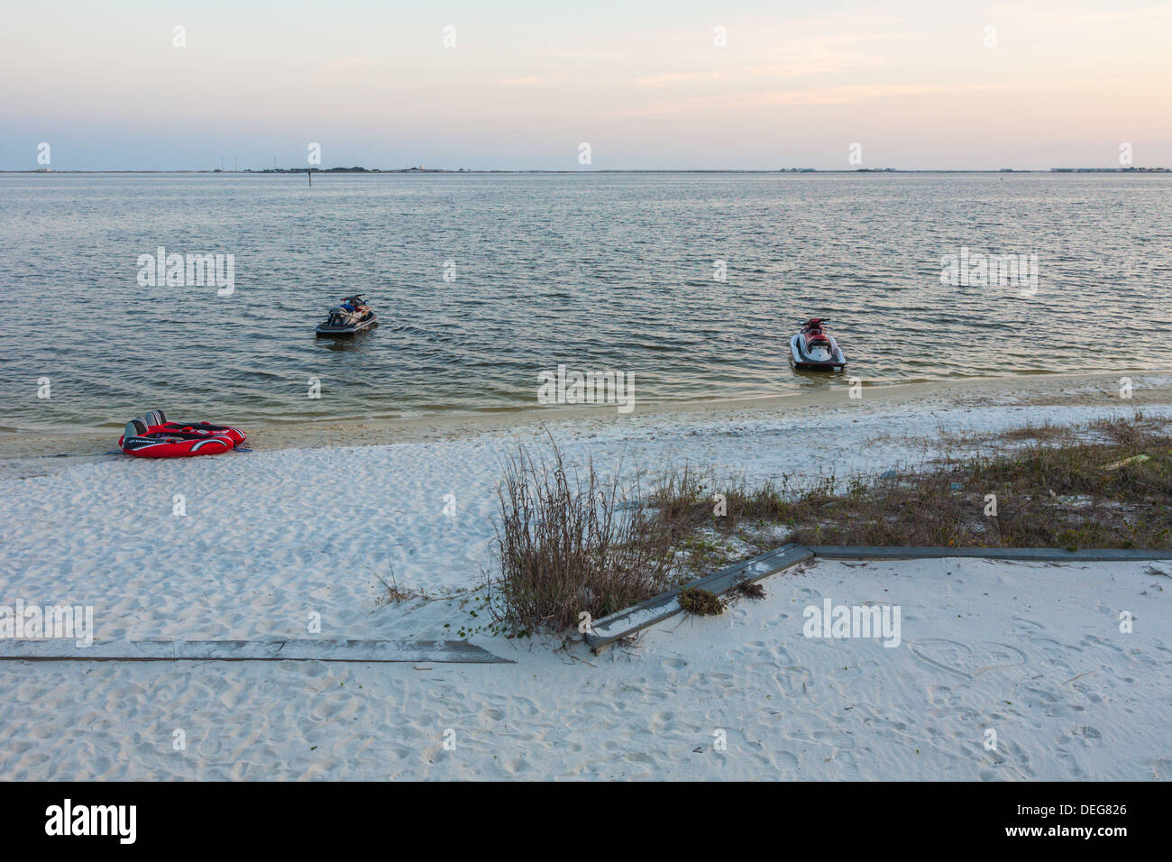 Two jet skis anchored in Santa Rosa Sound at a private white sand beach ...