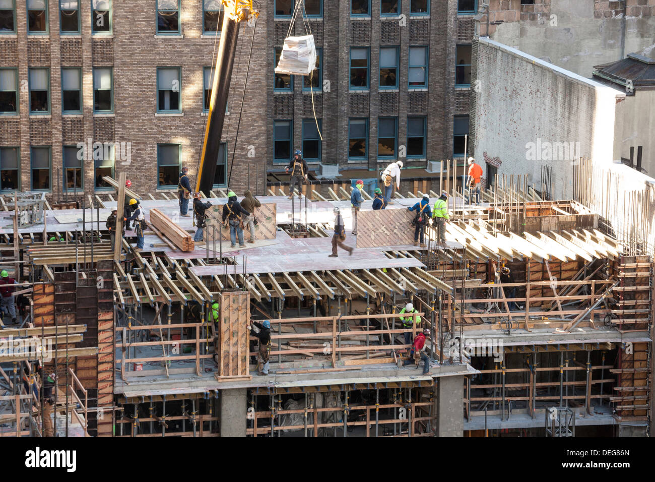 High-rise Building Construction Site with tradesmen (1 of 6 Stock Photo ...