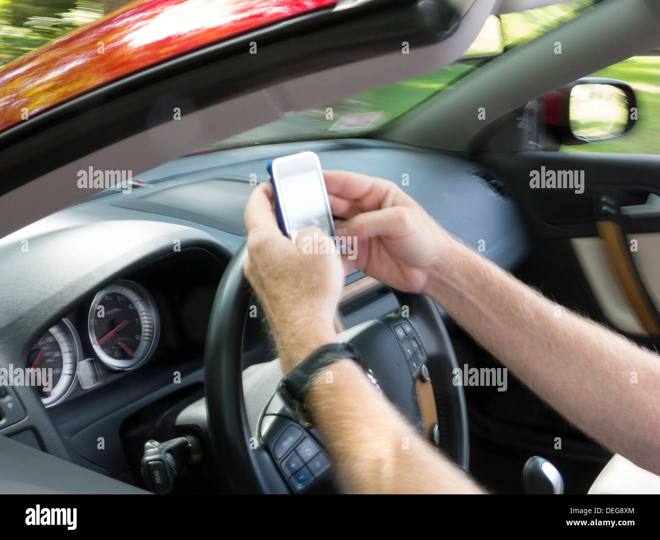 Male Hands Text Messaging While Driving Stock Photo - Alamy