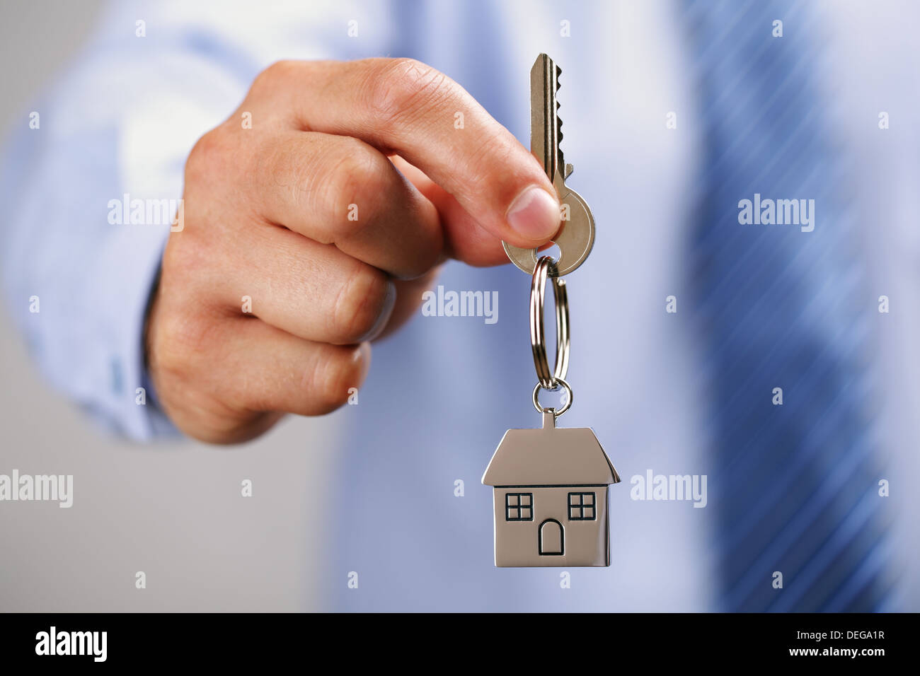 Giving house keys Stock Photo - Alamy