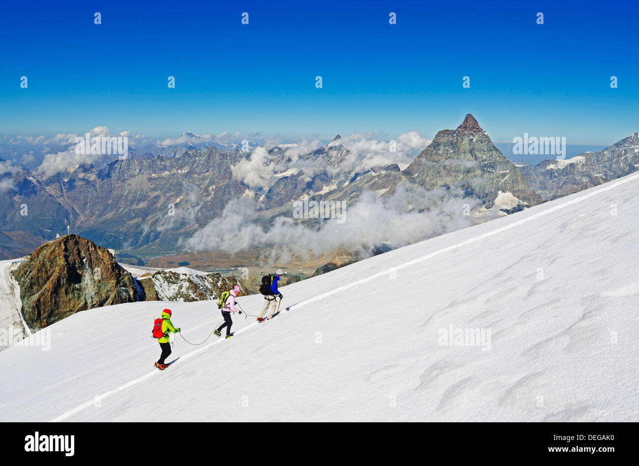 Climbers on Breithorn mountain, with the Matterhorn in the background ...
