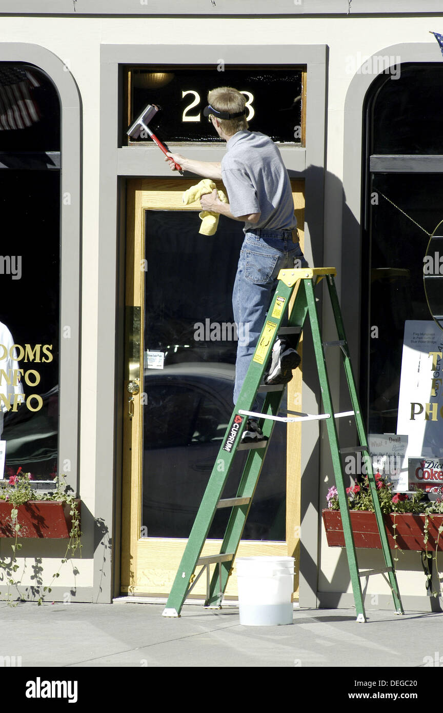 Man On Ladder Cleaning Windows High Resolution Stock Photography and ...