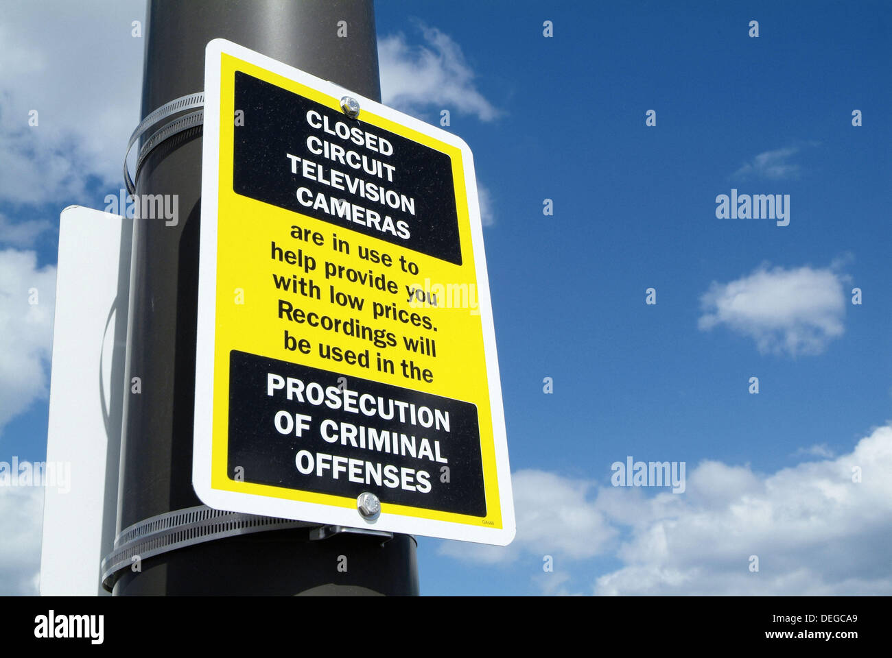 Closed circuit Television camera sign in the parking lot of a large ...