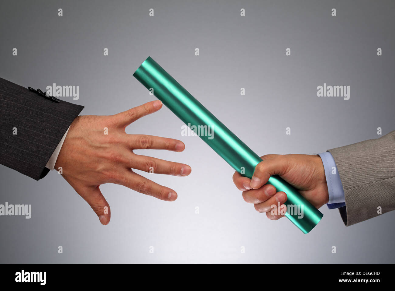 Teamwork passing the baton Stock Photo - Alamy