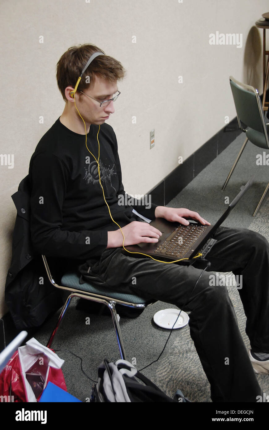 Adult businessman professional works on wireless laptop computer while ...