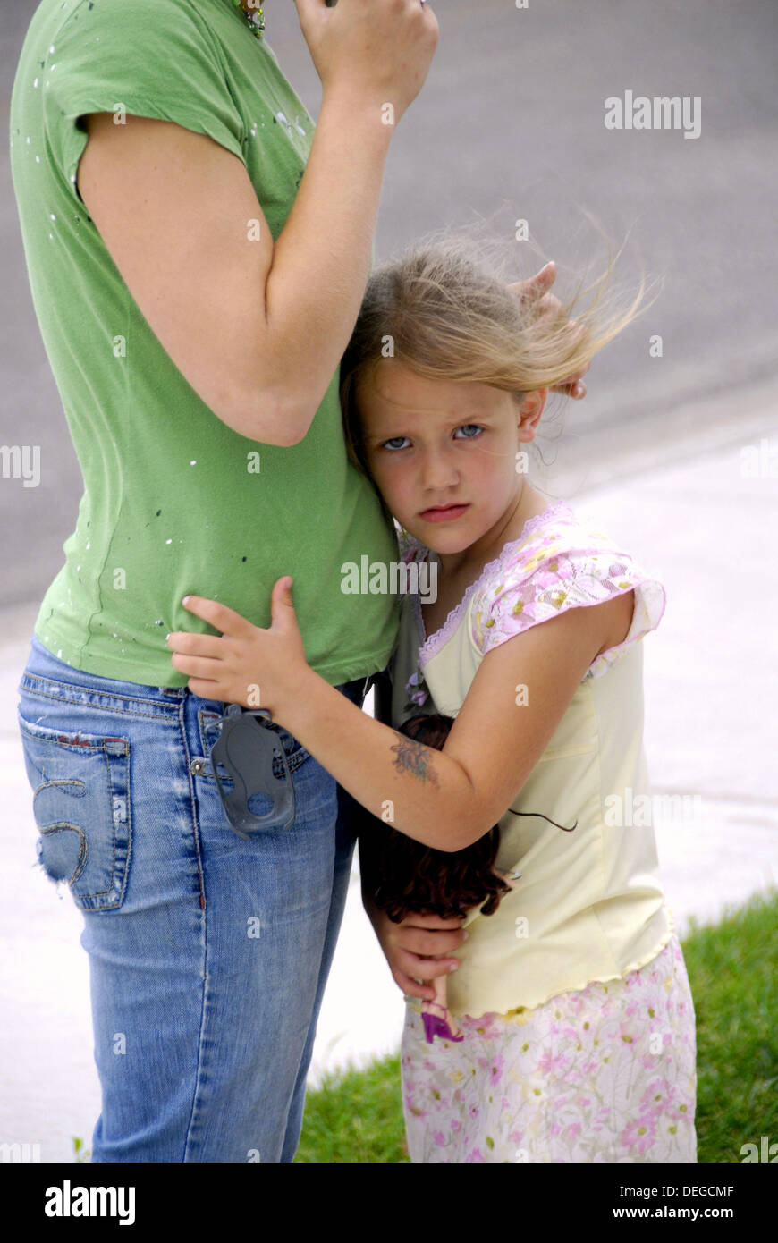 Child clings to mother hi-res stock photography and images - Alamy