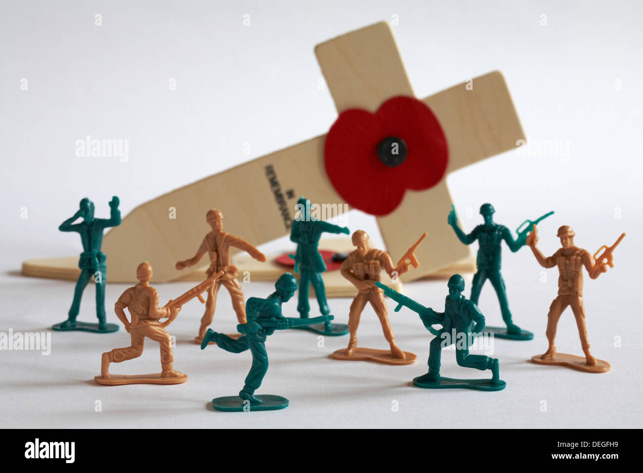 model toy soldiers in battle in front of British Legion Red Poppy In ...