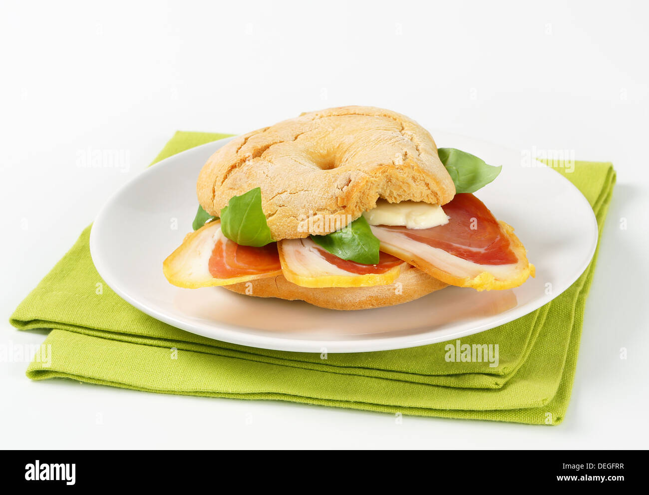 Ring-shaped roll with sliced prosciutto crudo and mozzarella Stock ...