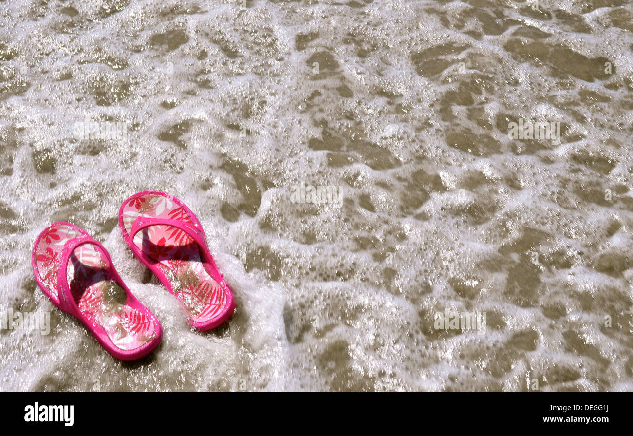 Flip Flops in the Sand Stock Photo - Alamy