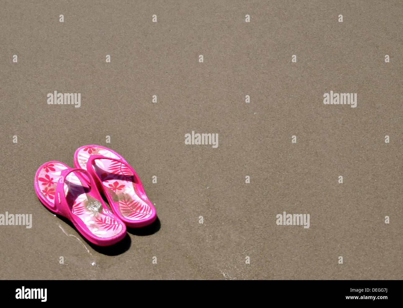 Flip Flops in the Sand Stock Photo - Alamy