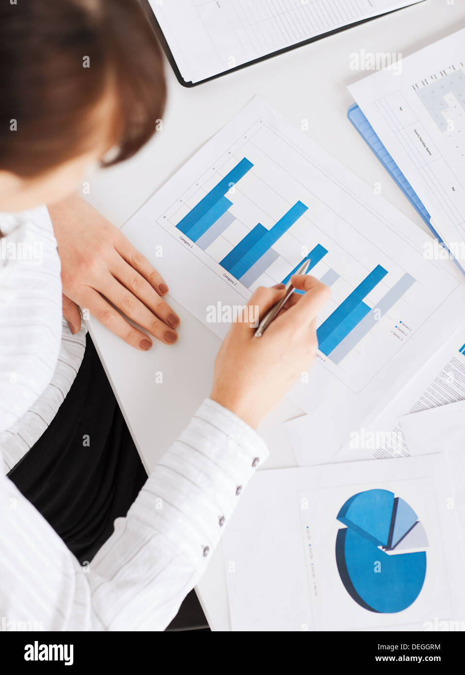 woman hand with charts and papers Stock Photo - Alamy
