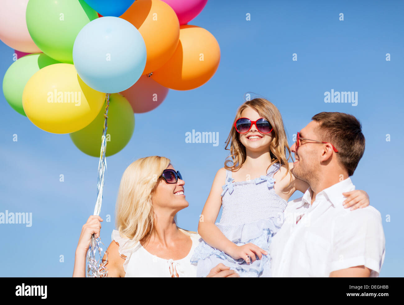 family with colorful balloons Stock Photo - Alamy