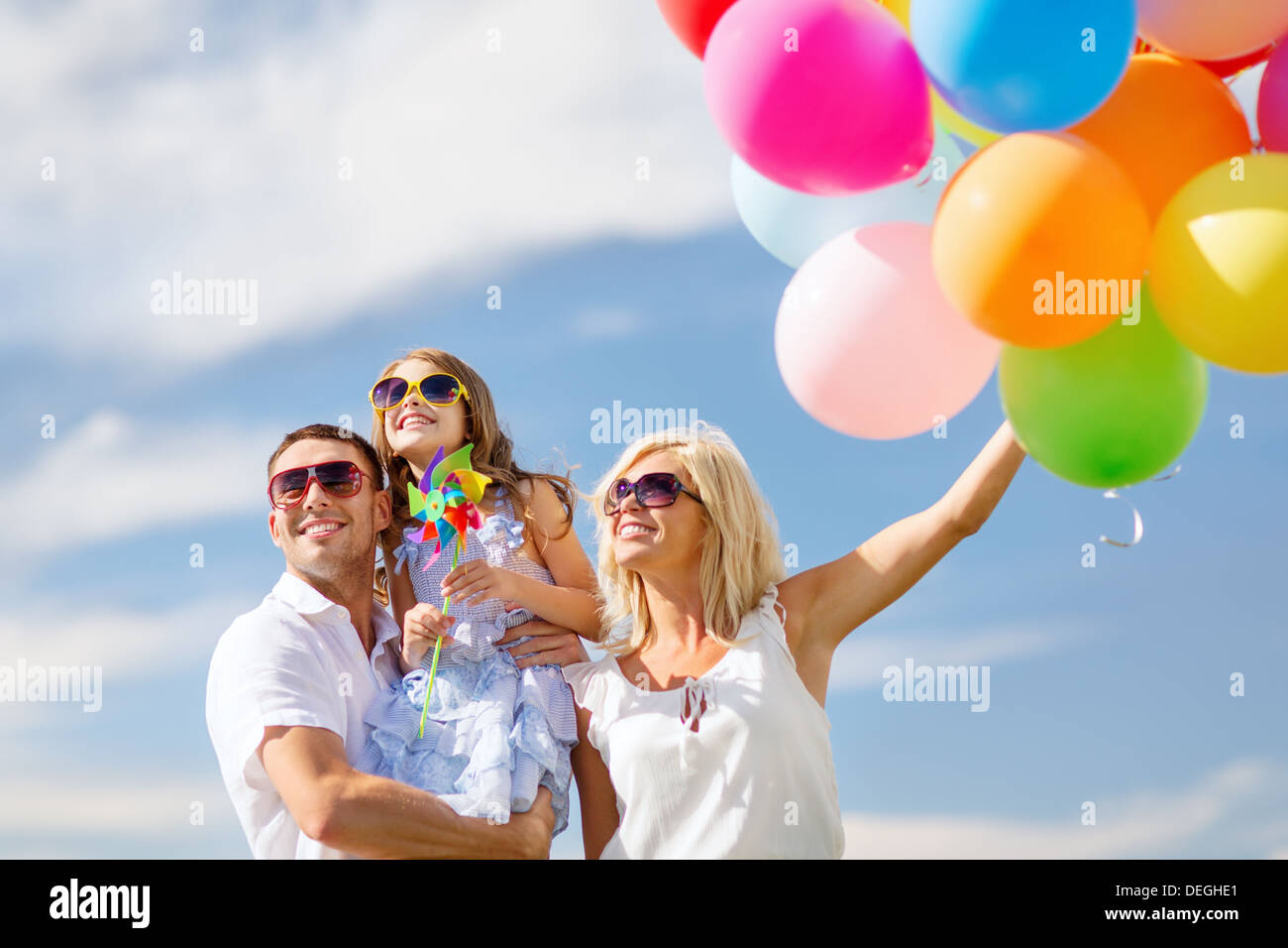 family with colorful balloons Stock Photo - Alamy