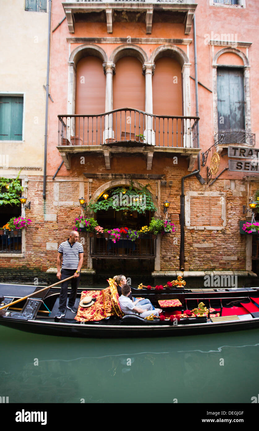 Tourist boating in the canal in front of building, Grand Canal, Venice ...