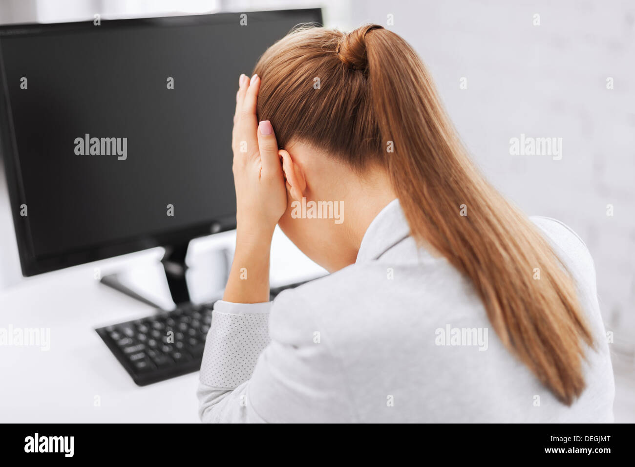 stressed woman with computer Stock Photo - Alamy