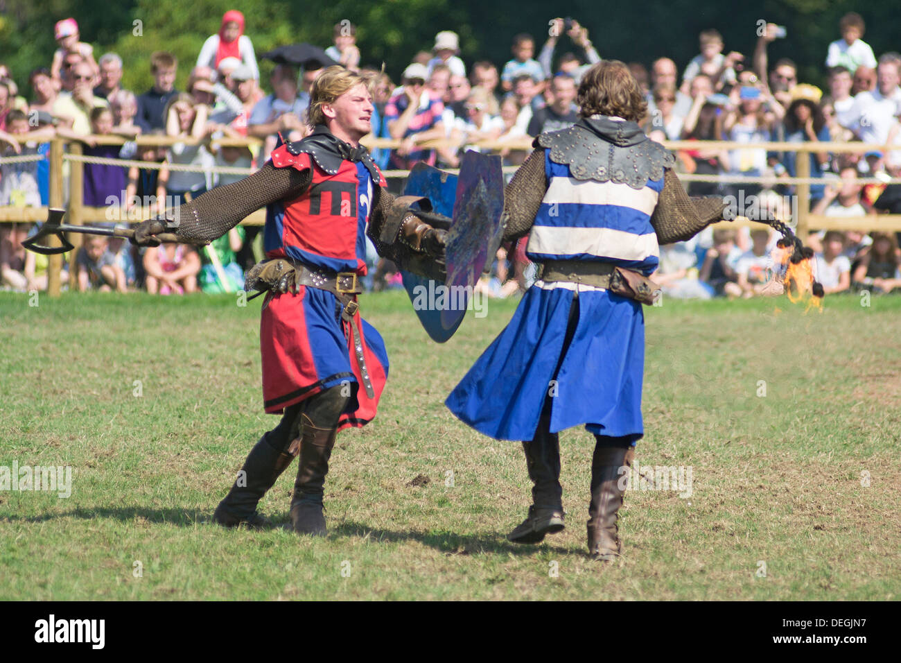 Crowds enjoy a display of fighting by the knights at Medieval Warwick ...