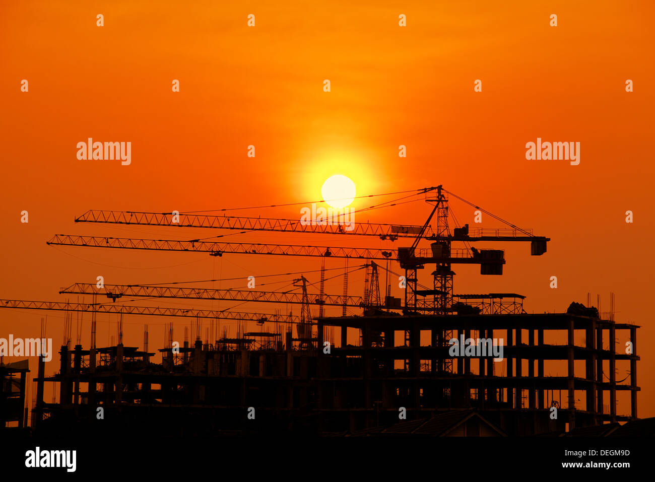 Construction site sunset silhouette crane hi-res stock photography and ...