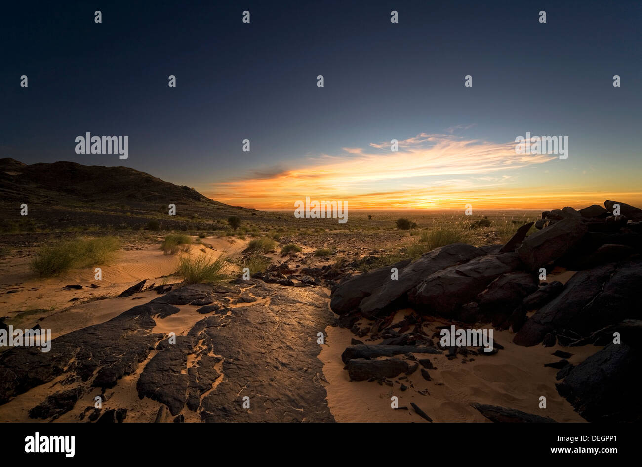 Dawn over granite rocky outcrop in hill location, Western Sahara desert ...