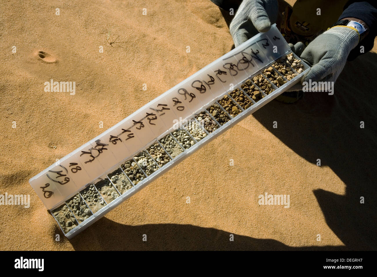 Gloved hands holding geology drilling chips hi-res stock photography ...