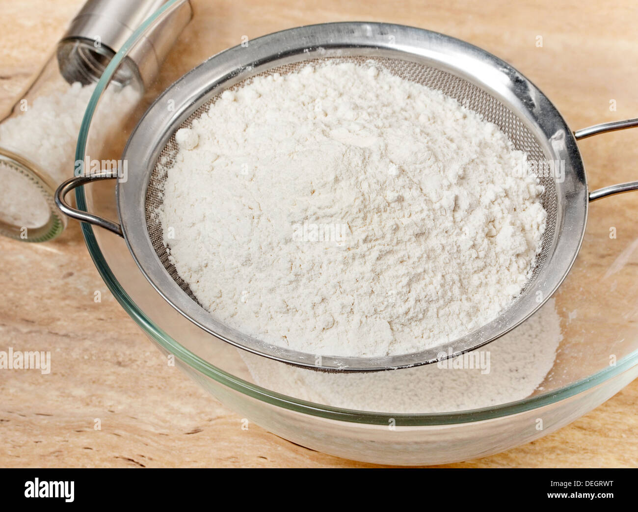 Preparing food flour ingredient sieve Stock Photo - Alamy