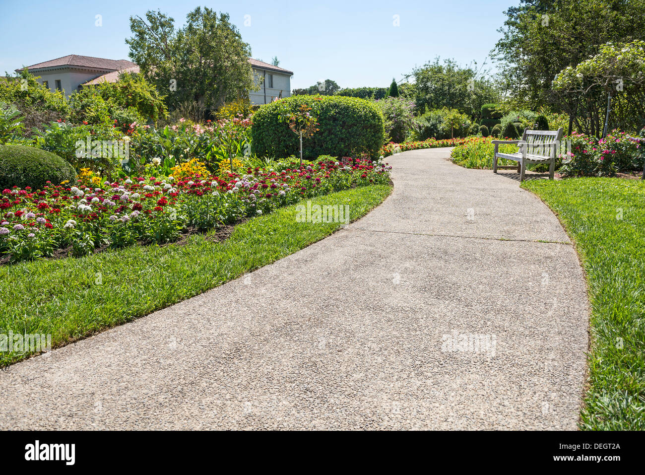 Winding walkway through beautiful and colorful garden at the Huntington ...