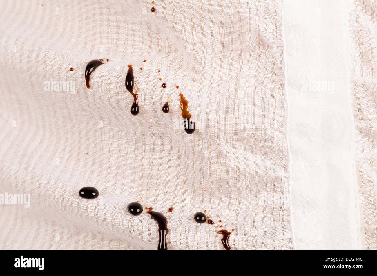 Fresh chocolate stains on what was a clean shirt Stock Photo - Alamy