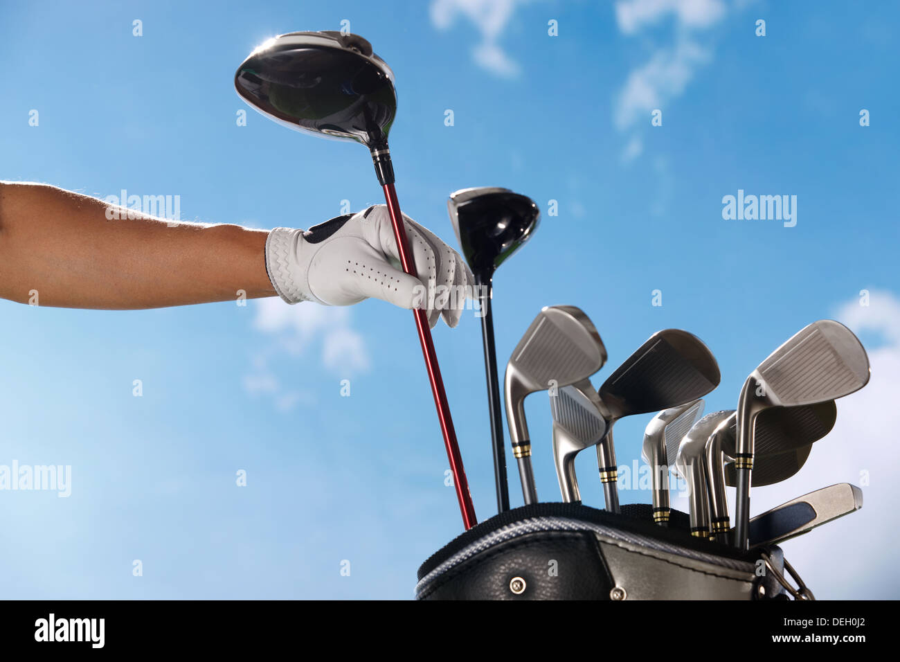 Removing golf club from bag Stock Photo - Alamy