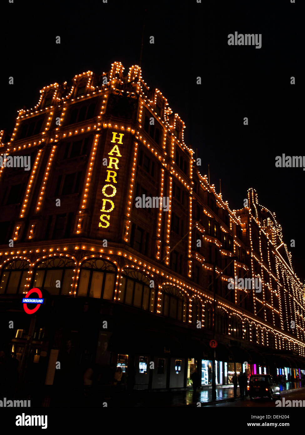Harrods Department Store at night showing London Underground sign ...