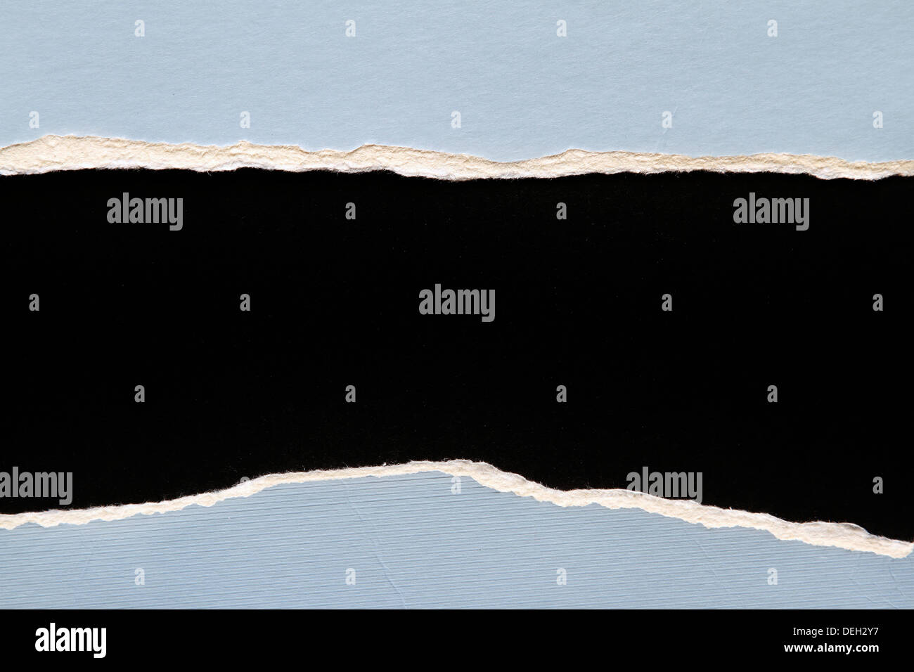 Blue torn paper black hi-res stock photography and images - Alamy