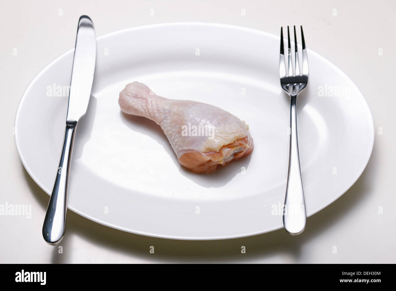 chicken leg and cutlery Stock Photo - Alamy