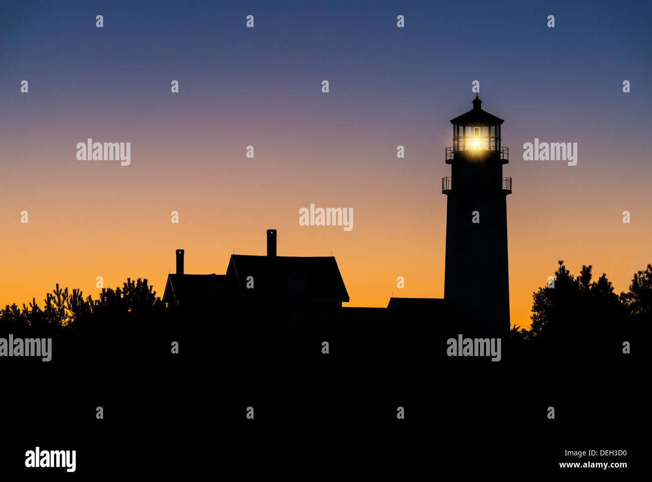 Sillhouette of a lighthouse at dawn, Highland Light, Truro, Cape Cod ...