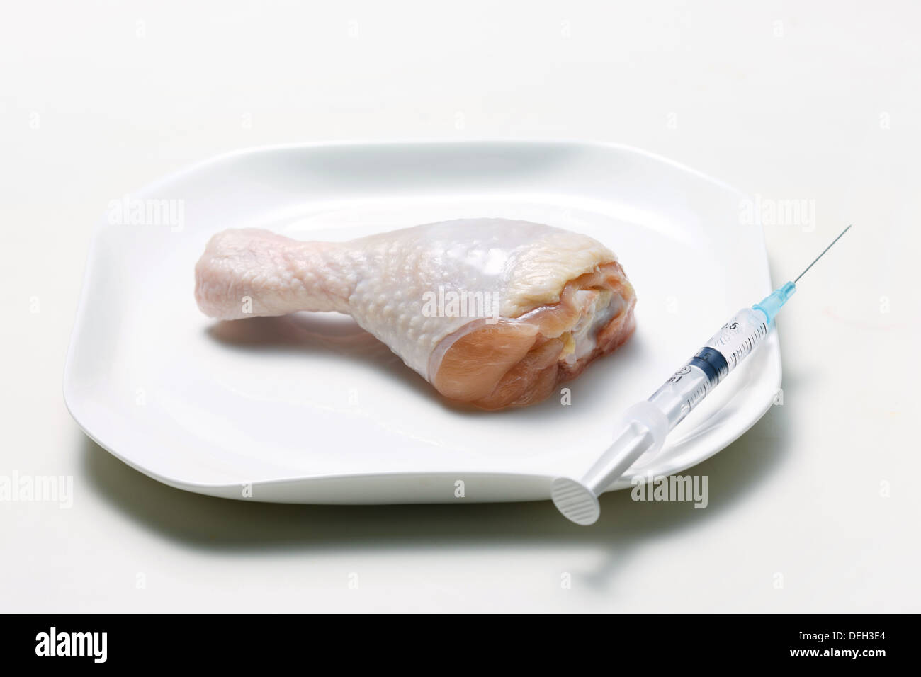chicken leg and injector Stock Photo - Alamy
