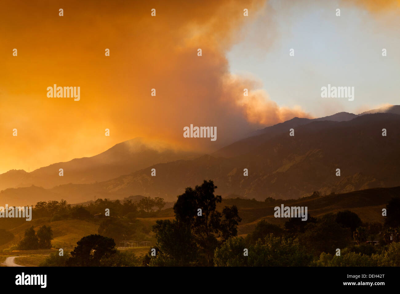 Smoke plume from a wildfire on the hills in Southern California USA ...