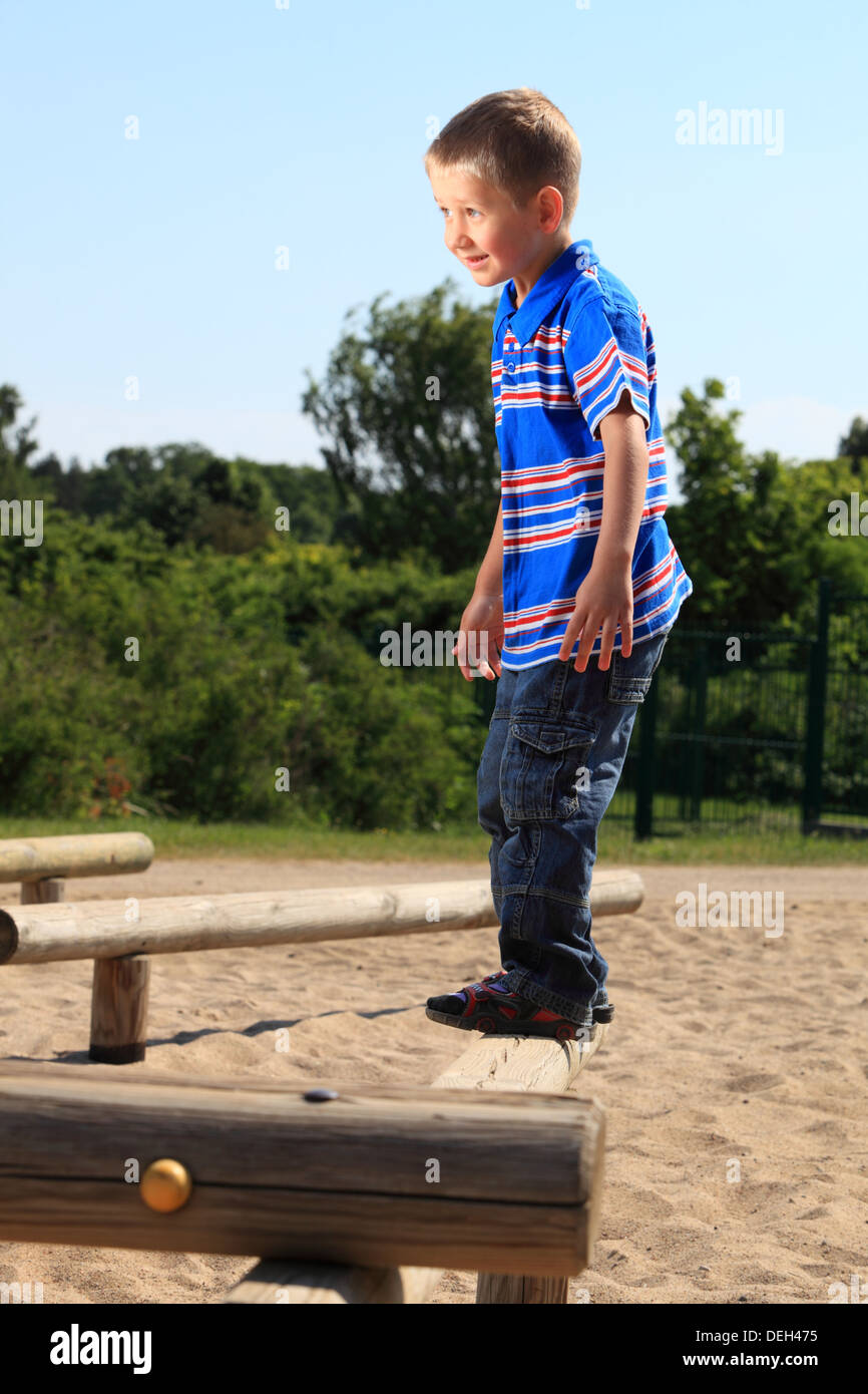 child in playground kid in action boy play on leisure equipment Stock ...