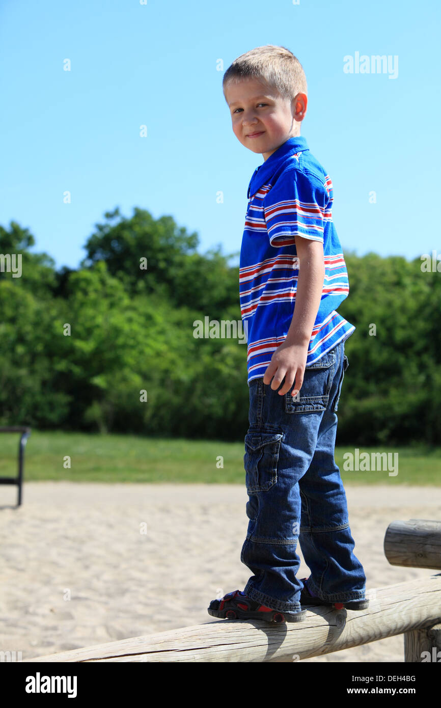 child in playground kid in action boy play on leisure equipment Stock ...