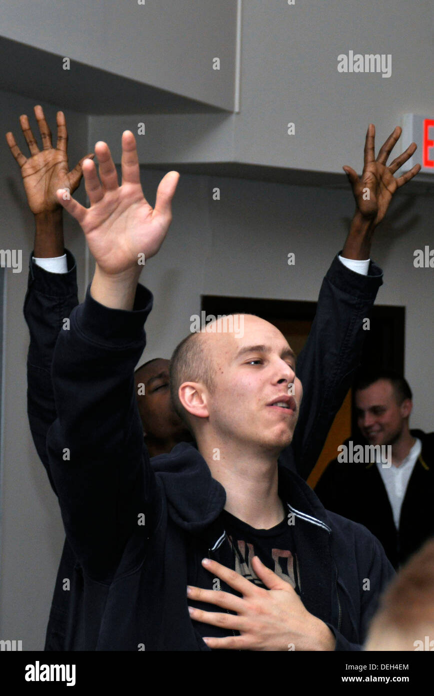 Man worshiping God at a worship service Stock Photo - Alamy