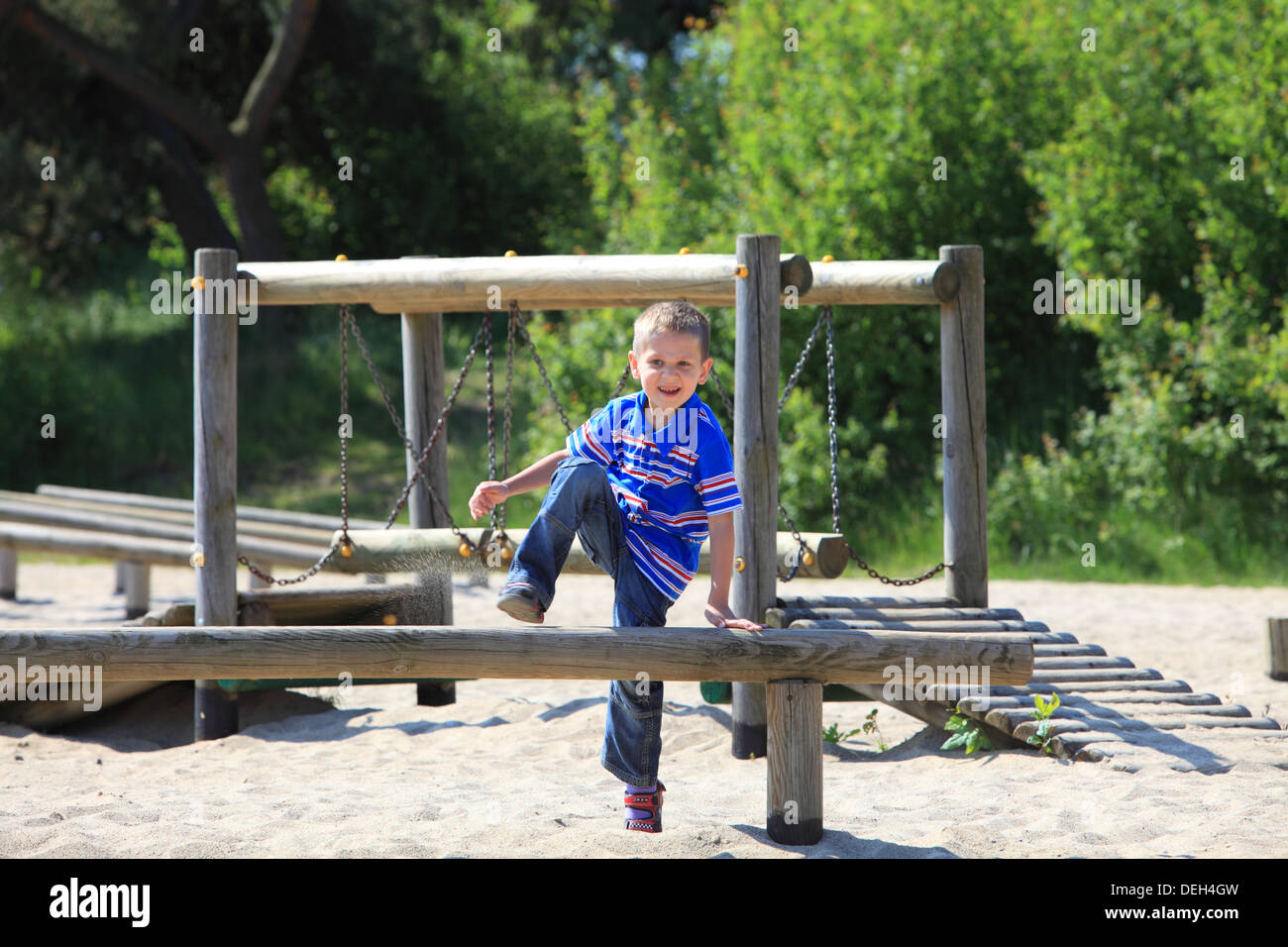 child in playground kid in action boy play on leisure equipment Stock ...