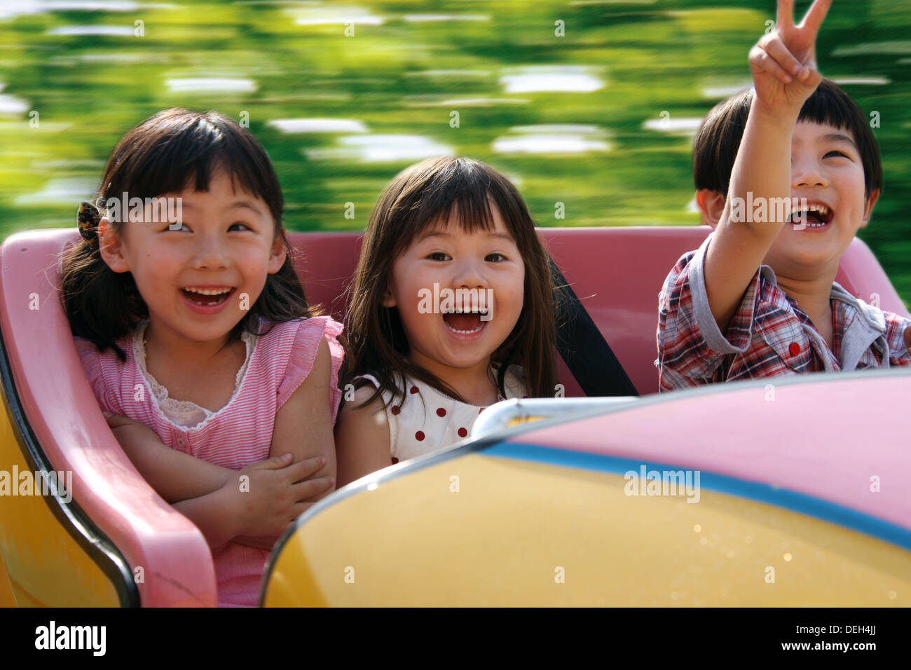 Oriental children playing outdoors Stock Photo - Alamy