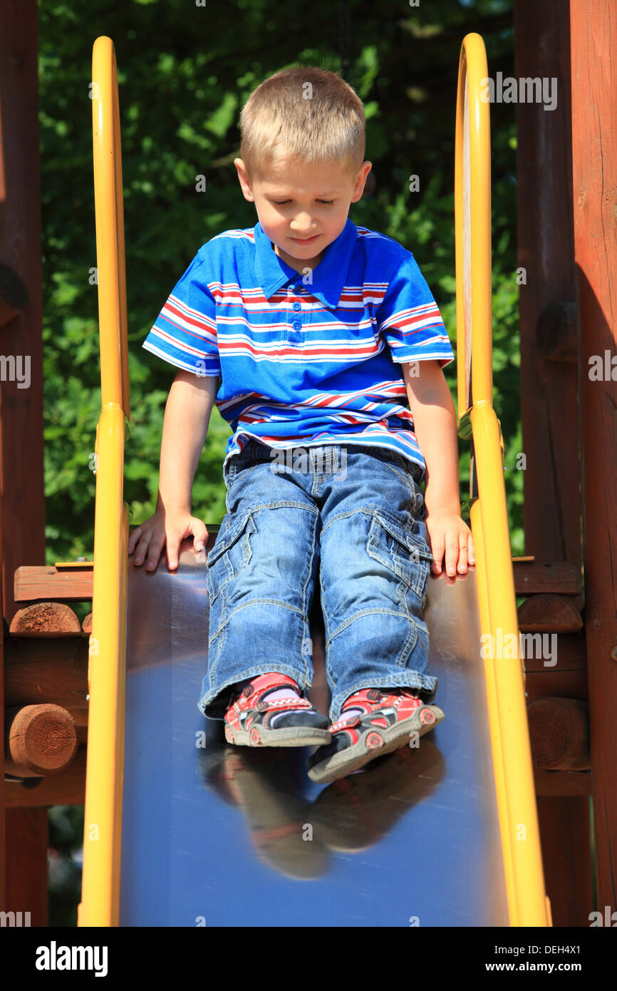 child in playground kid in action boy play on leisure equipment ready ...