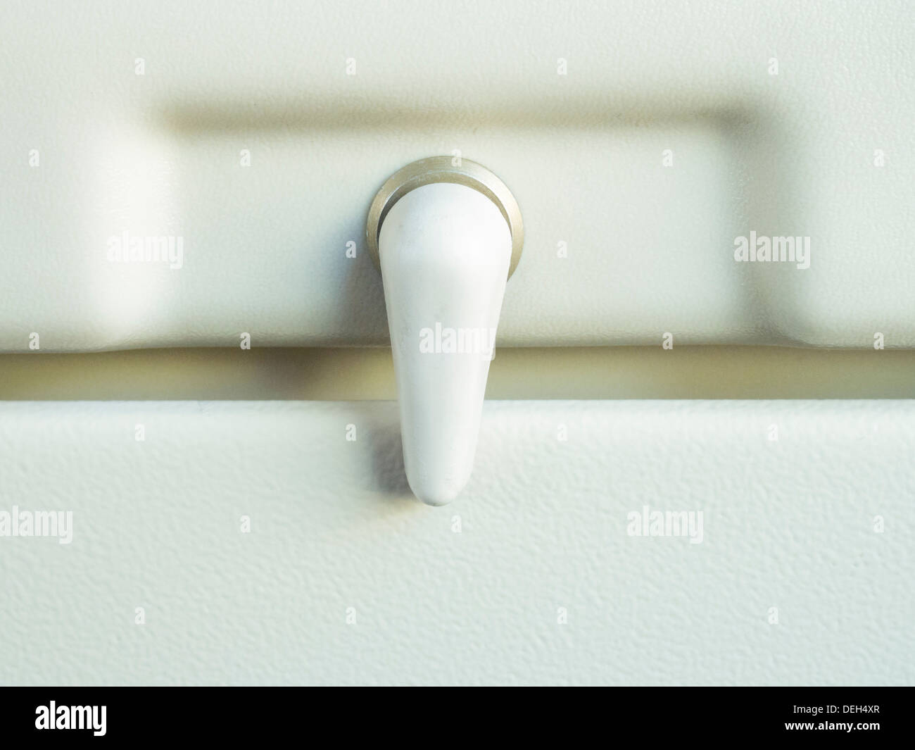 white plastic knob holds folding table Stock Photo - Alamy