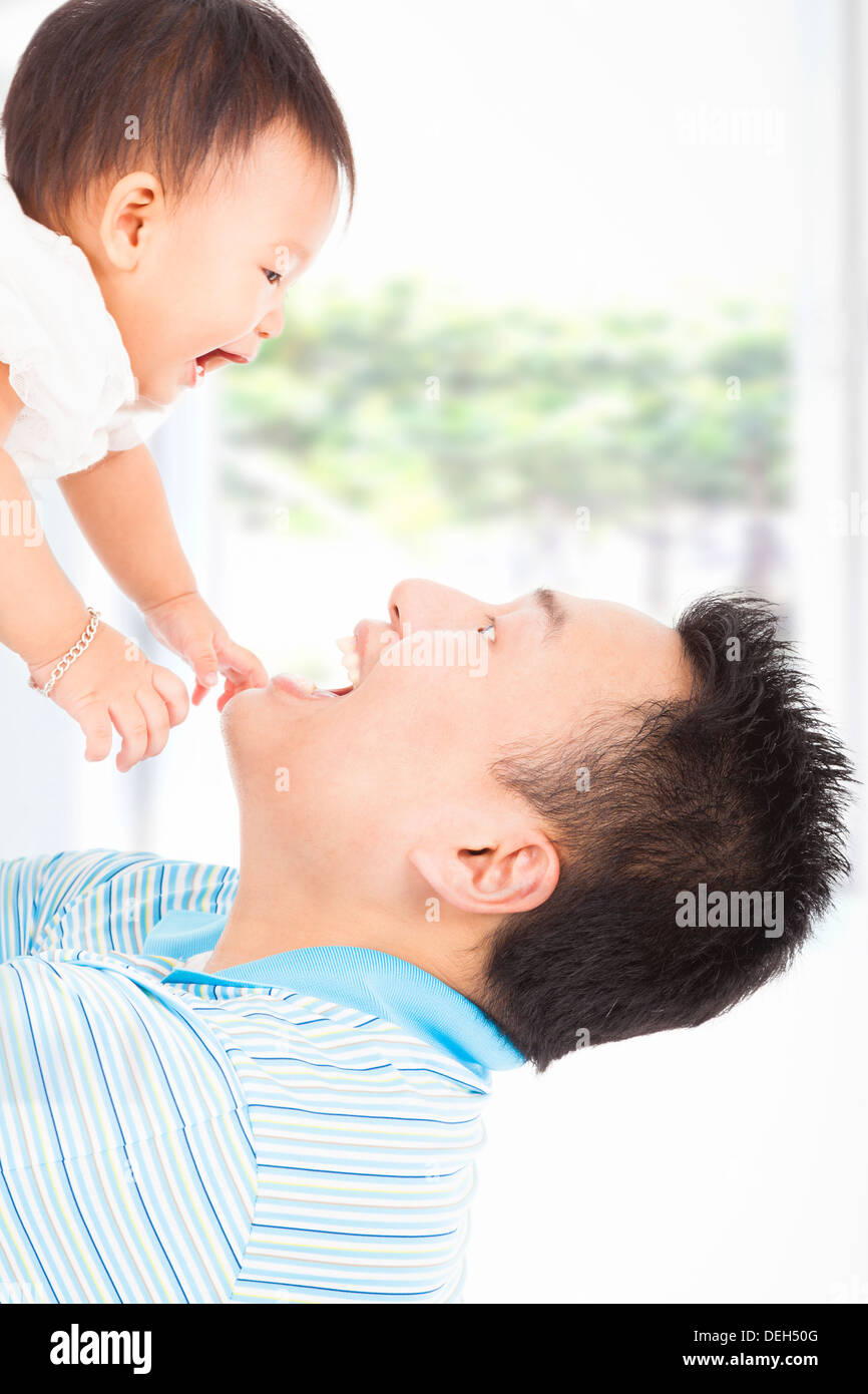 happy father and baby playing Stock Photo - Alamy