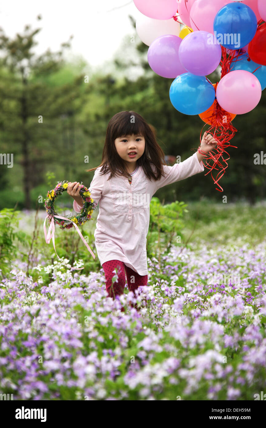 Oriental children playing outdoors Stock Photo - Alamy