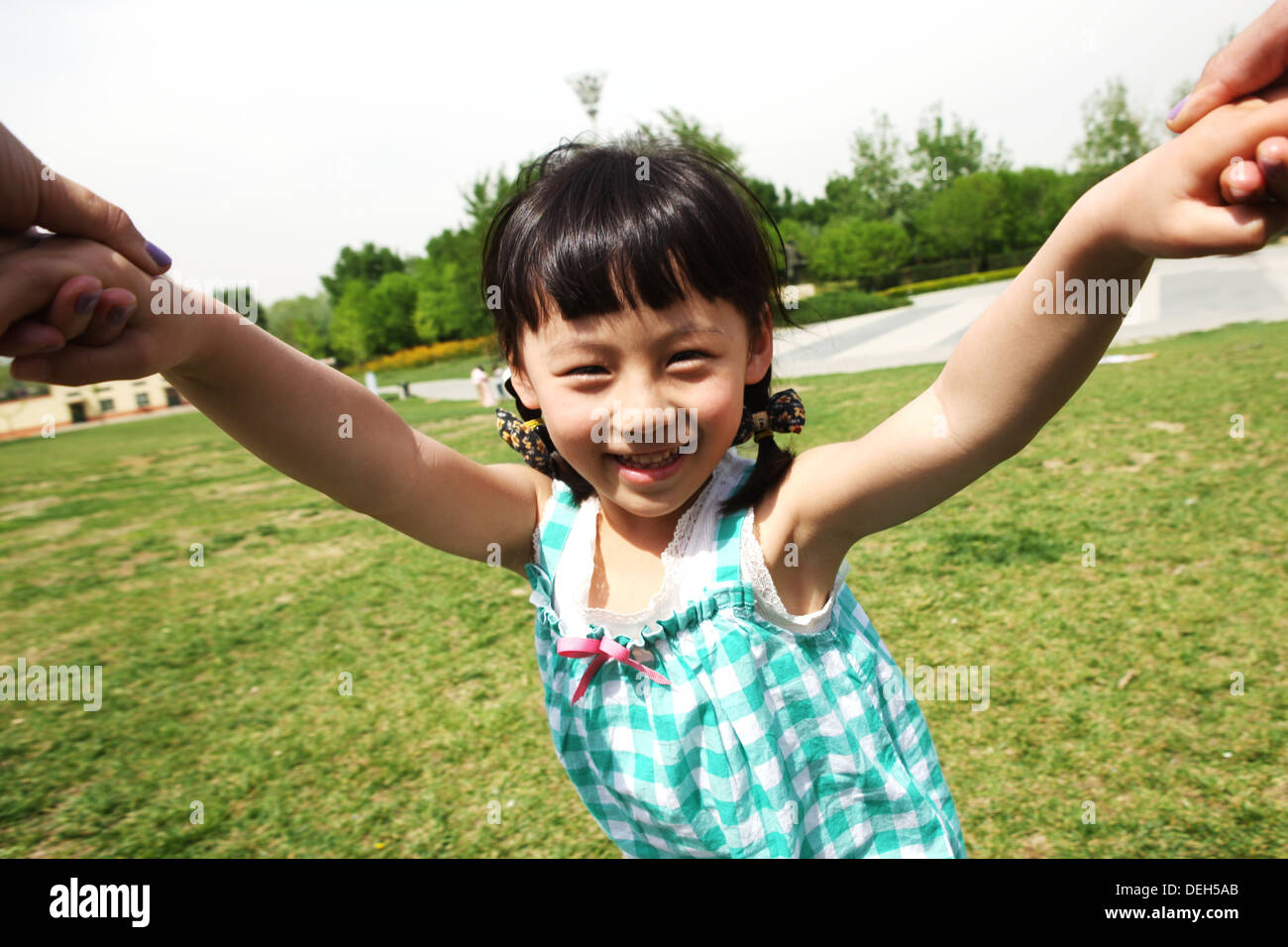 Oriental children playing outdoors Stock Photo - Alamy