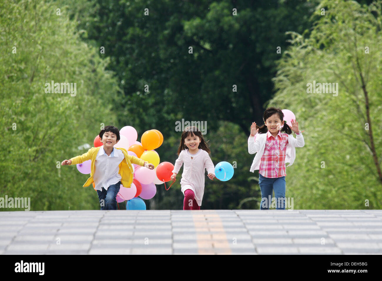 Oriental children playing outdoors Stock Photo - Alamy
