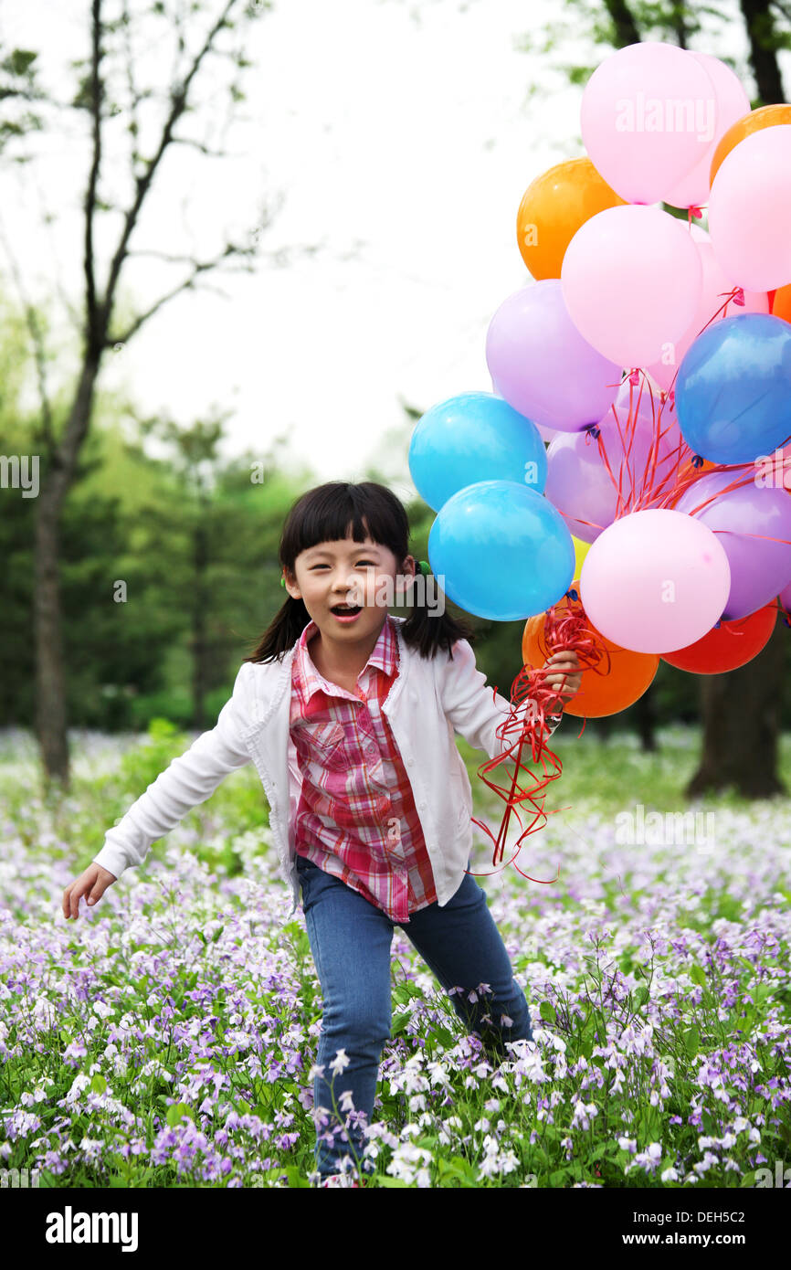 A girl playing outside Stock Photo - Alamy